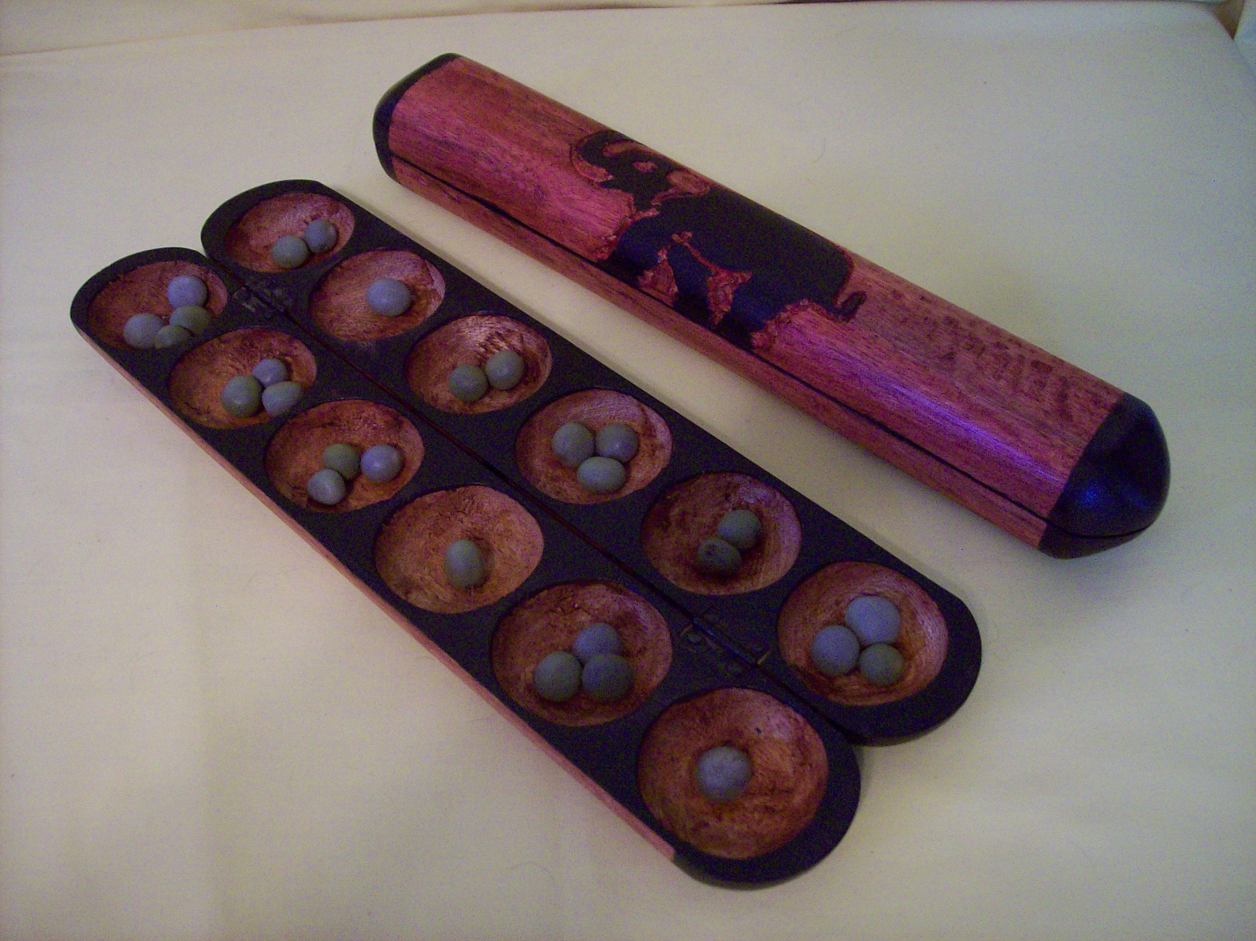 Handcrafted wooden African “Mancala” game. | global inspirations, llc