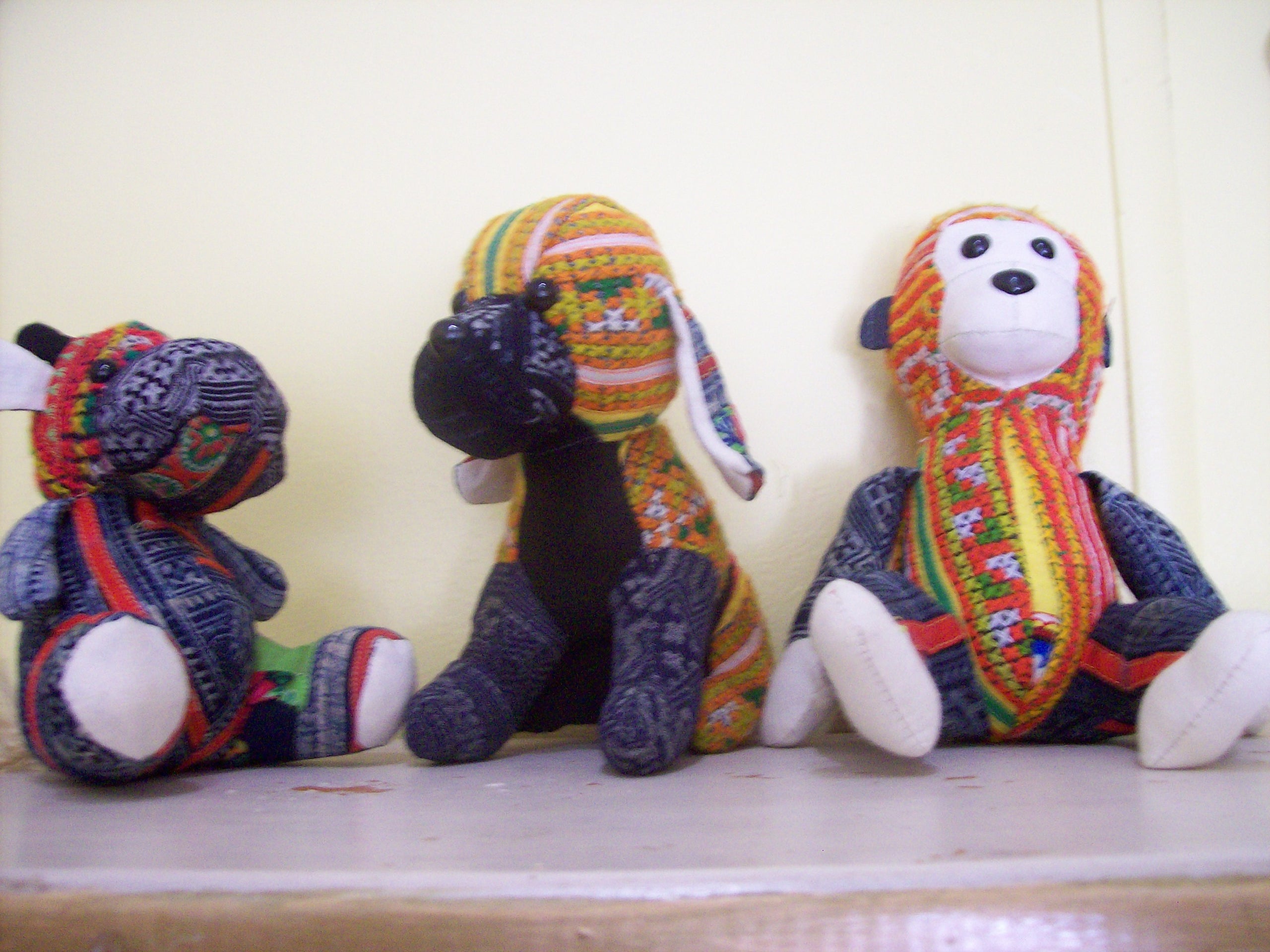 Hand embroidered colorful stuffed animals | global inspirations, llc